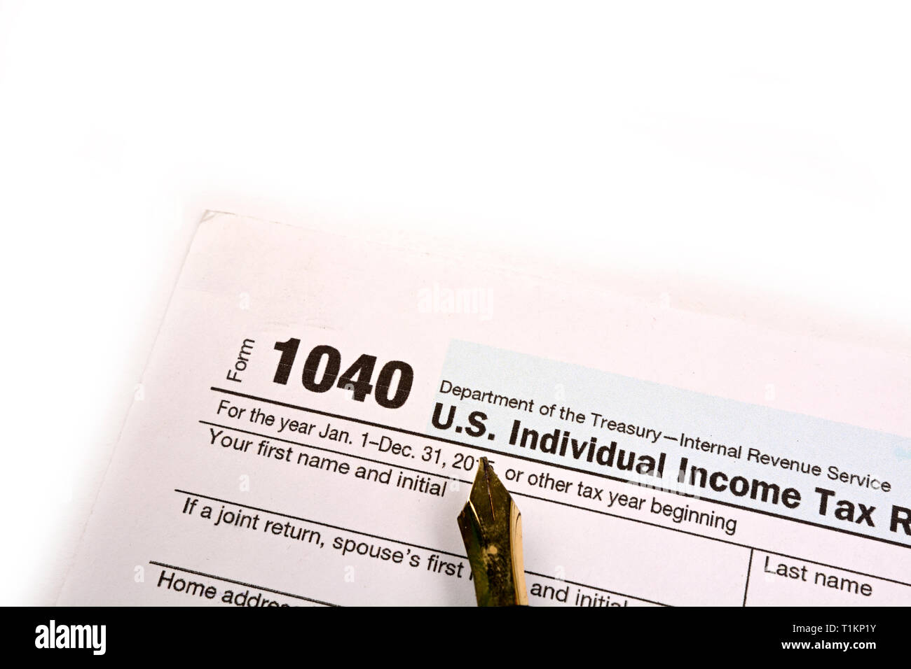 Completing US tax return form 1040 on white background Stock Photo - Alamy