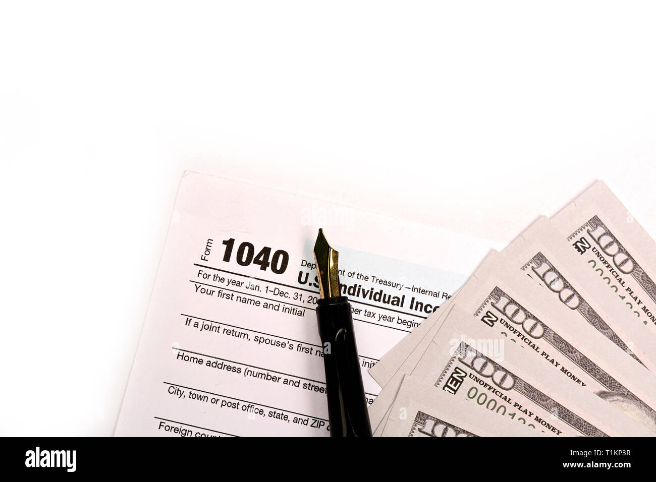 Completing US tax return form 1040 on white background Stock Photo - Alamy