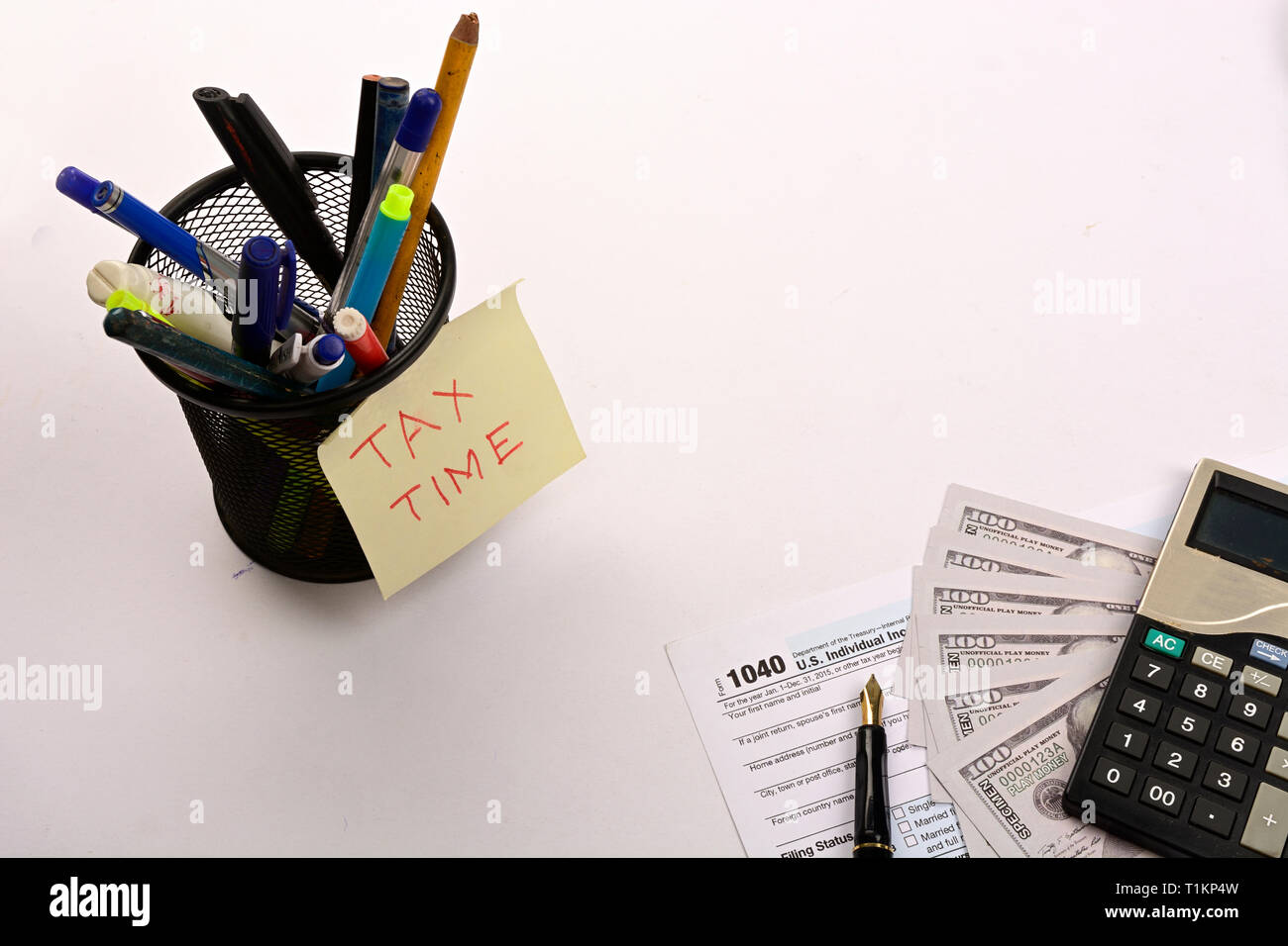 Completing US tax return form 1040 on white background Stock Photo - Alamy