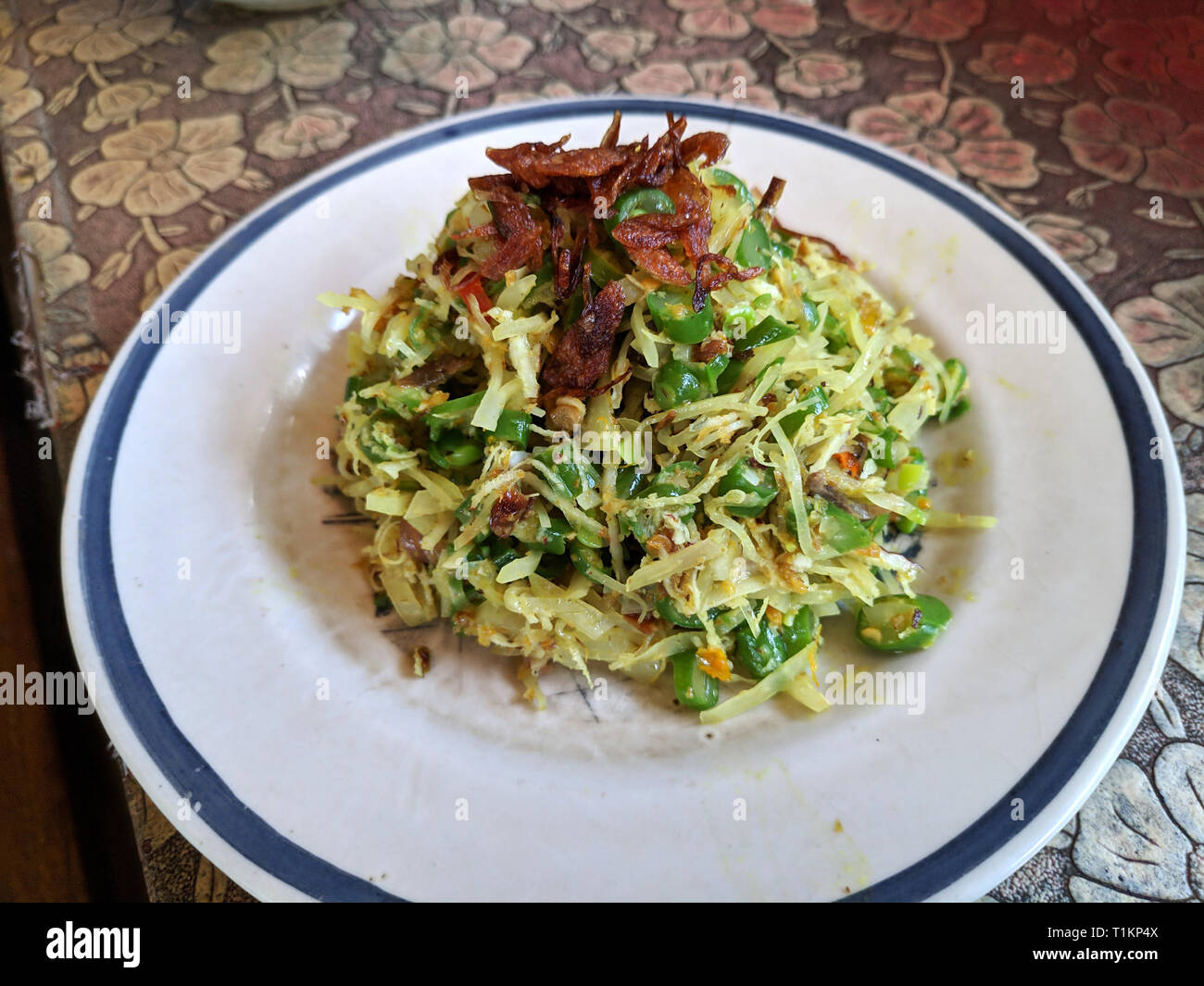 Lawar, a traditional dish from Bali. Green bean salad with chicken ...
