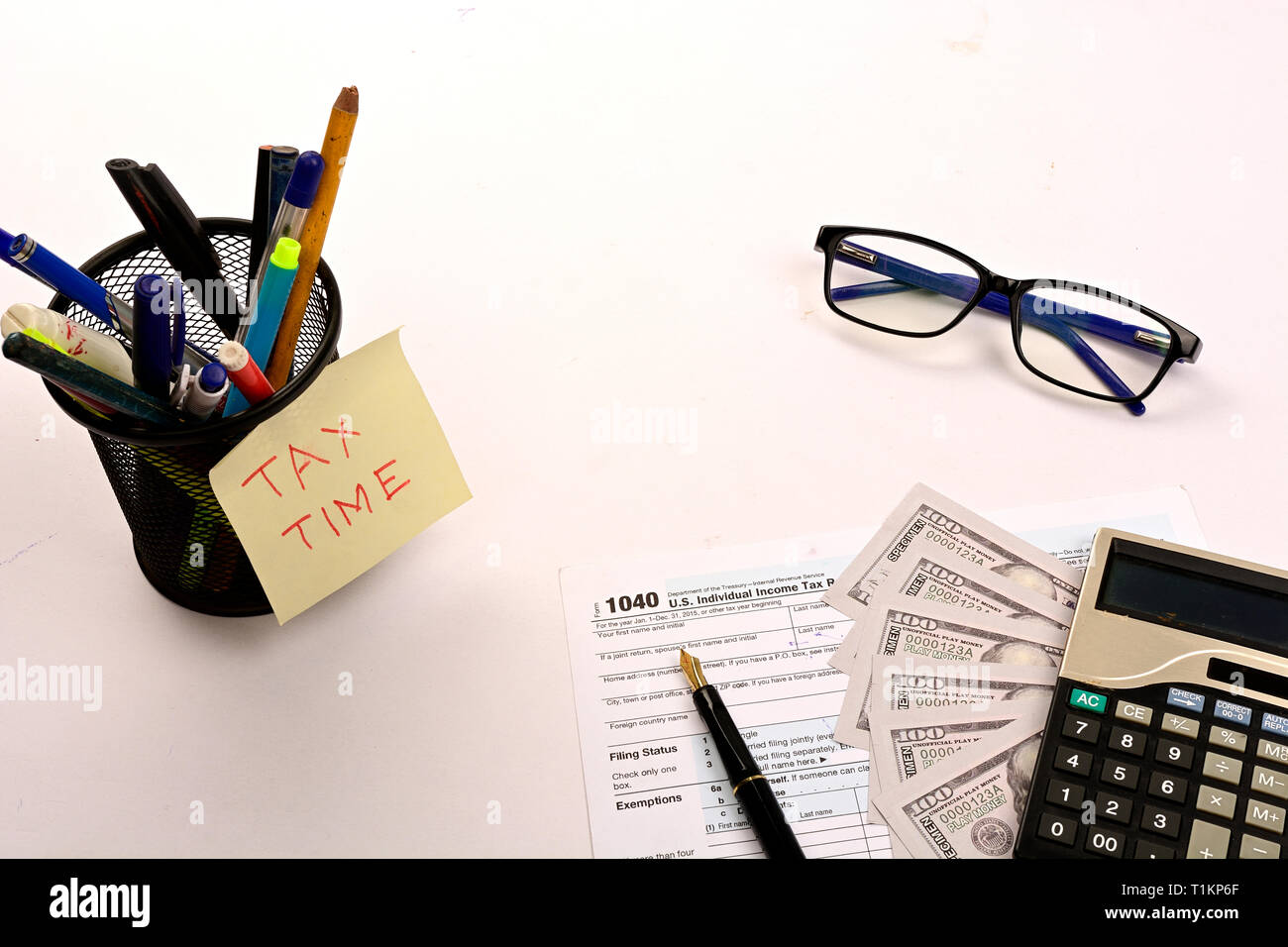 Completing US tax return form 1040 on white background Stock Photo - Alamy