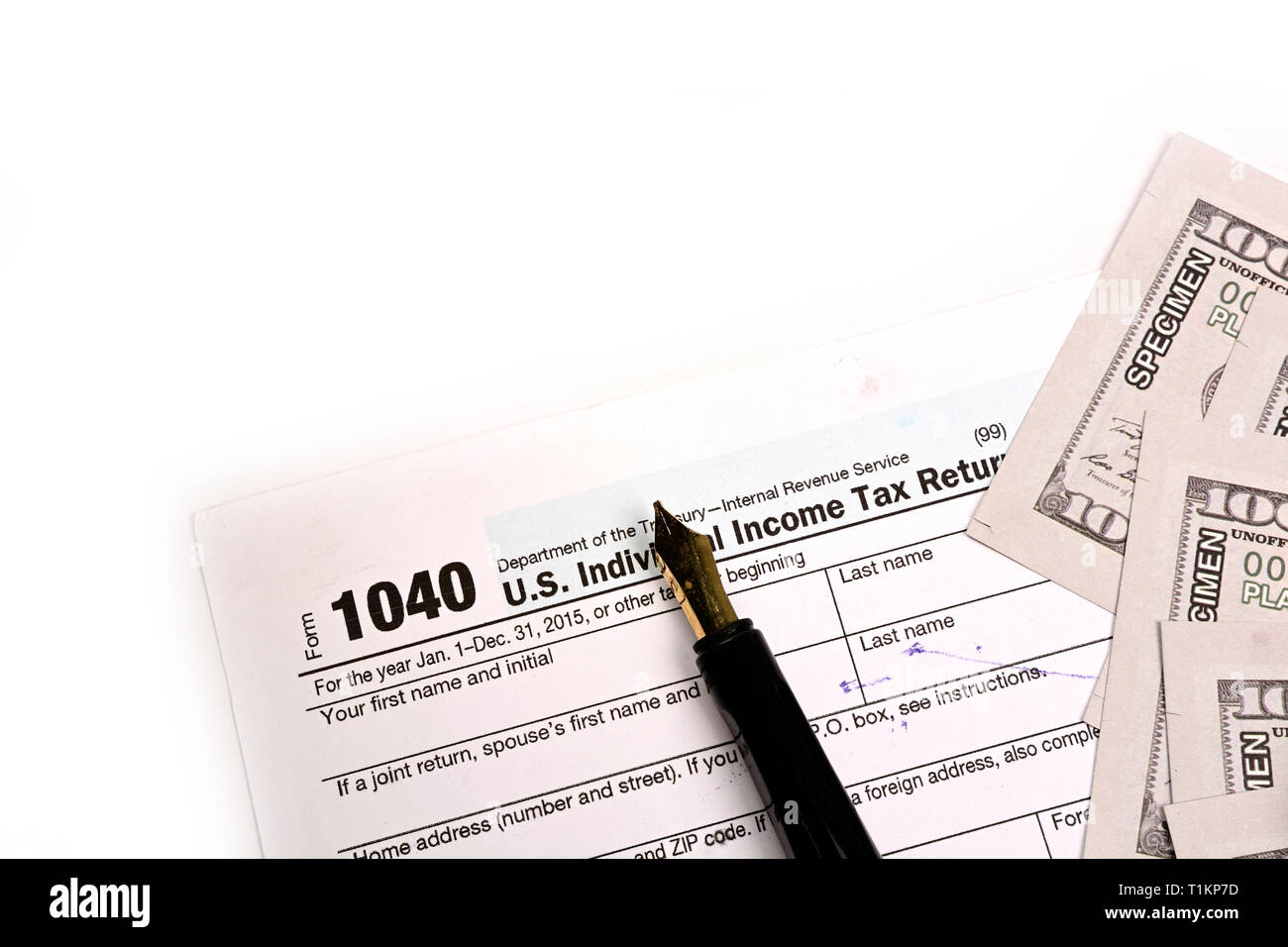 Completing US tax return form 1040 on white background Stock Photo - Alamy