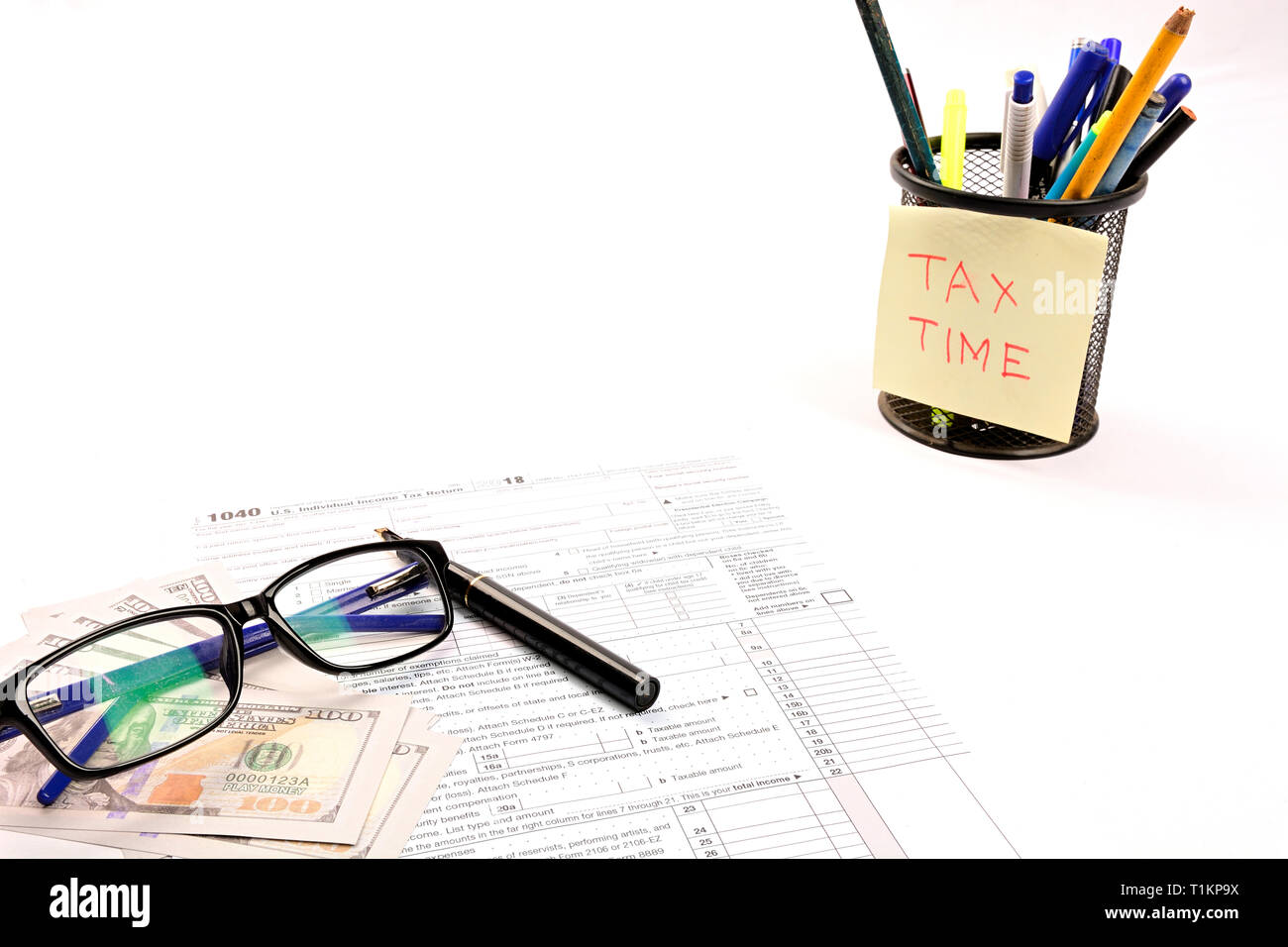 Completing US tax return form 1040 on white background Stock Photo - Alamy