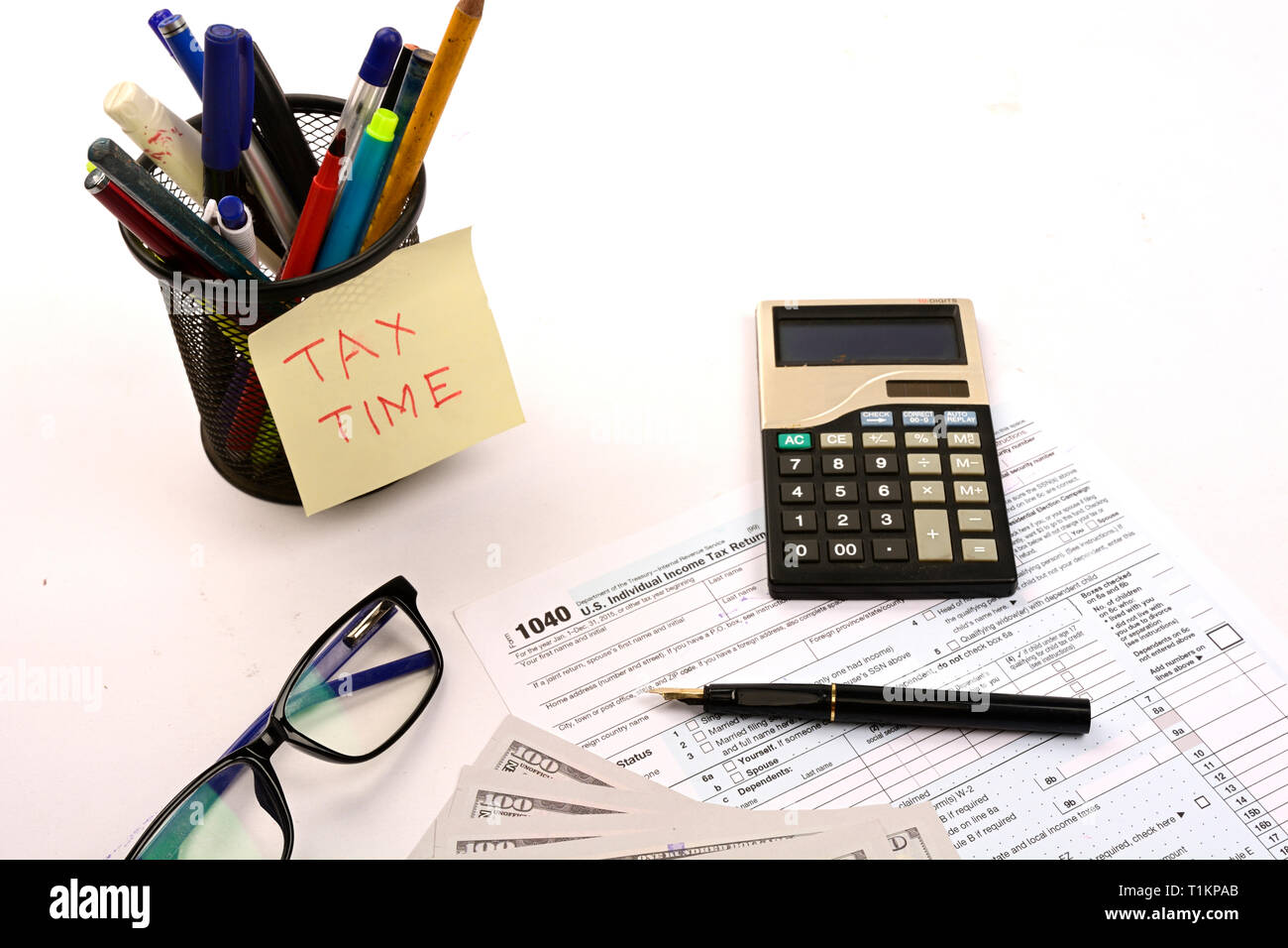 Completing US tax return form 1040 on white background Stock Photo - Alamy