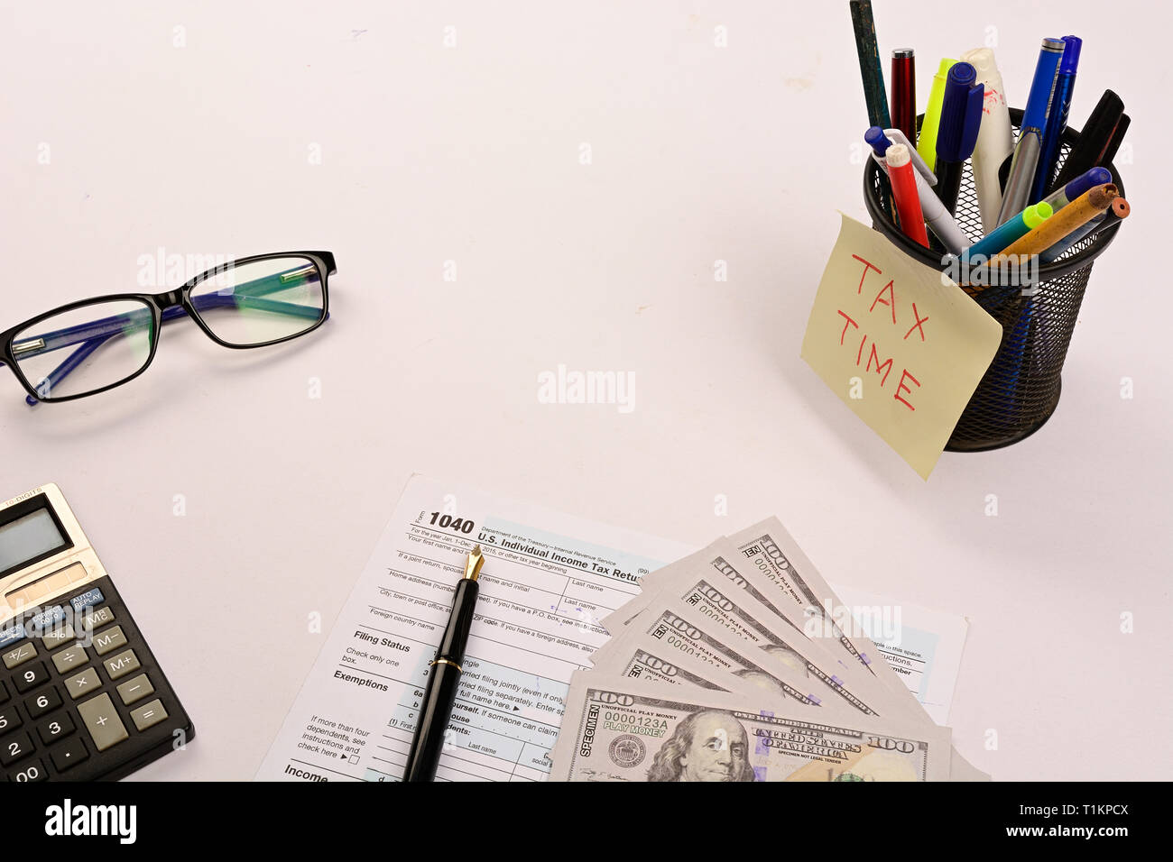 Completing US tax return form 1040 on white background Stock Photo - Alamy