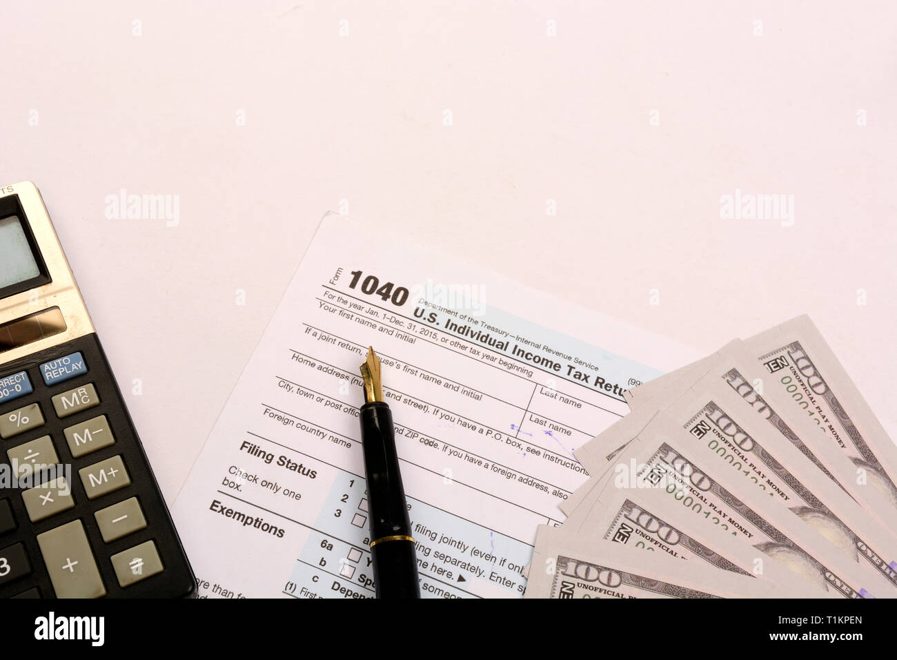 Completing US tax return form 1040 on white background Stock Photo - Alamy