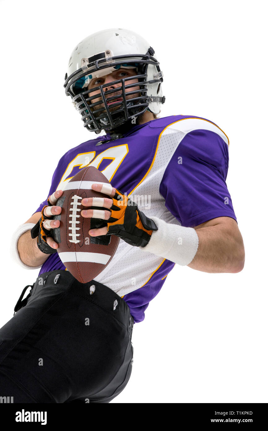 American Footballer posing in studio Stock Photo - Alamy