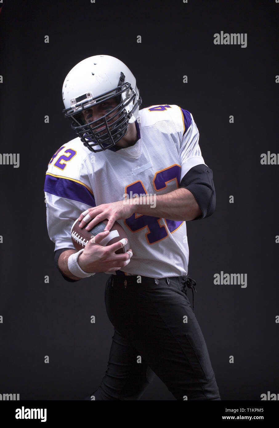 American Footballer running fast Stock Photo - Alamy