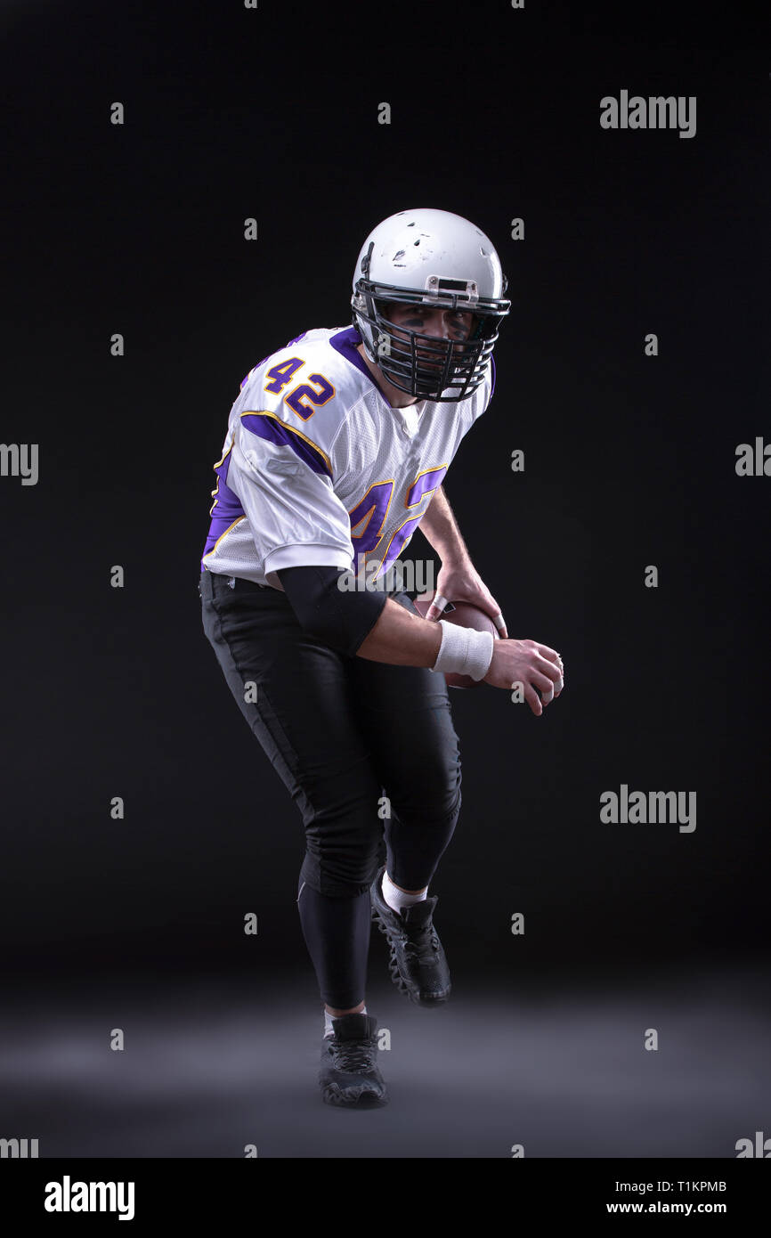 American Footballer running fast Stock Photo - Alamy