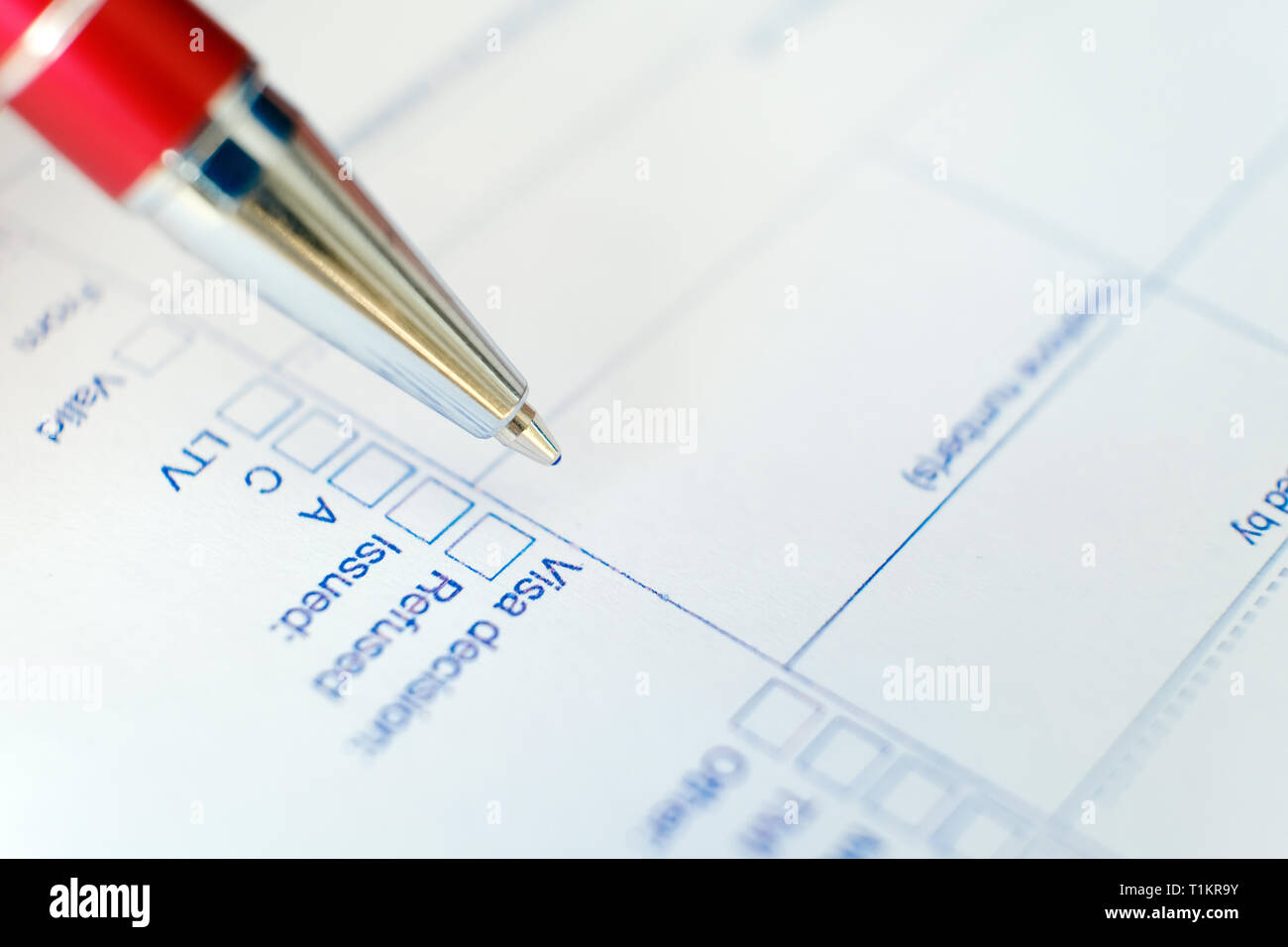 Schengen visa, questionnaire. Hand with pen completing a questionary ...