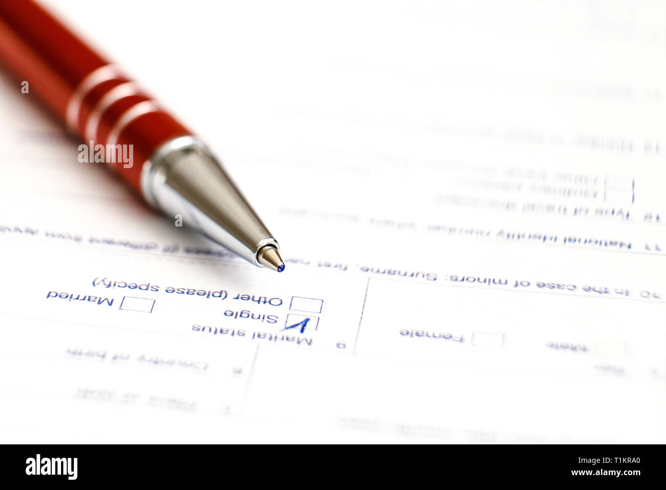 Schengen visa, questionnaire. Hand with pen completing a questionary ...