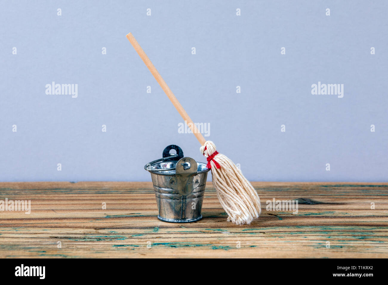Metal bucket and broom Stock Photo - Alamy