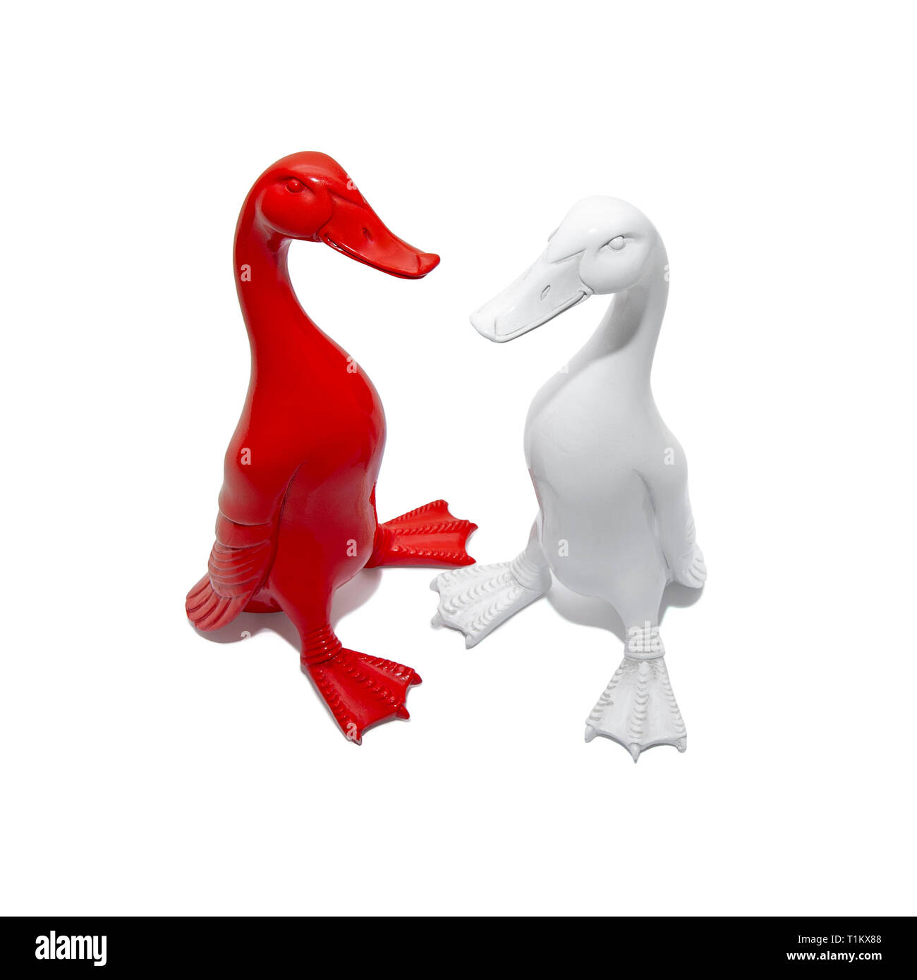 Two colorful goose sculptures on a white background Stock Photo - Alamy