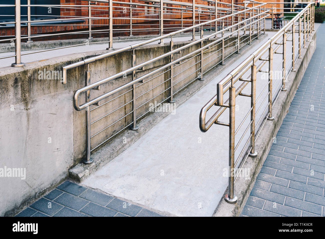 Concrete ramp way with stainless steel handrail for support wheelchair ...