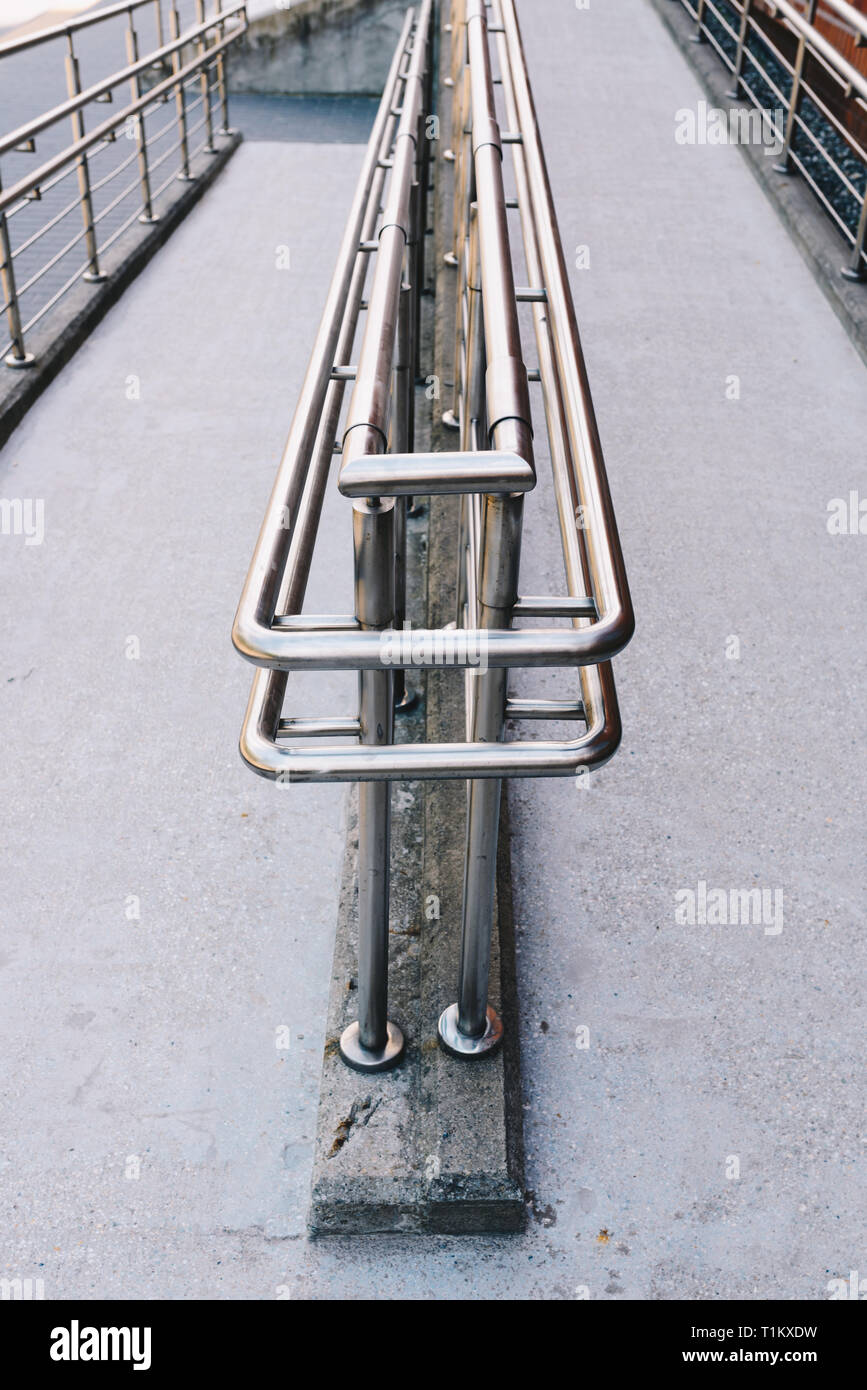 Concrete ramp way with stainless steel handrail for support wheelchair ...