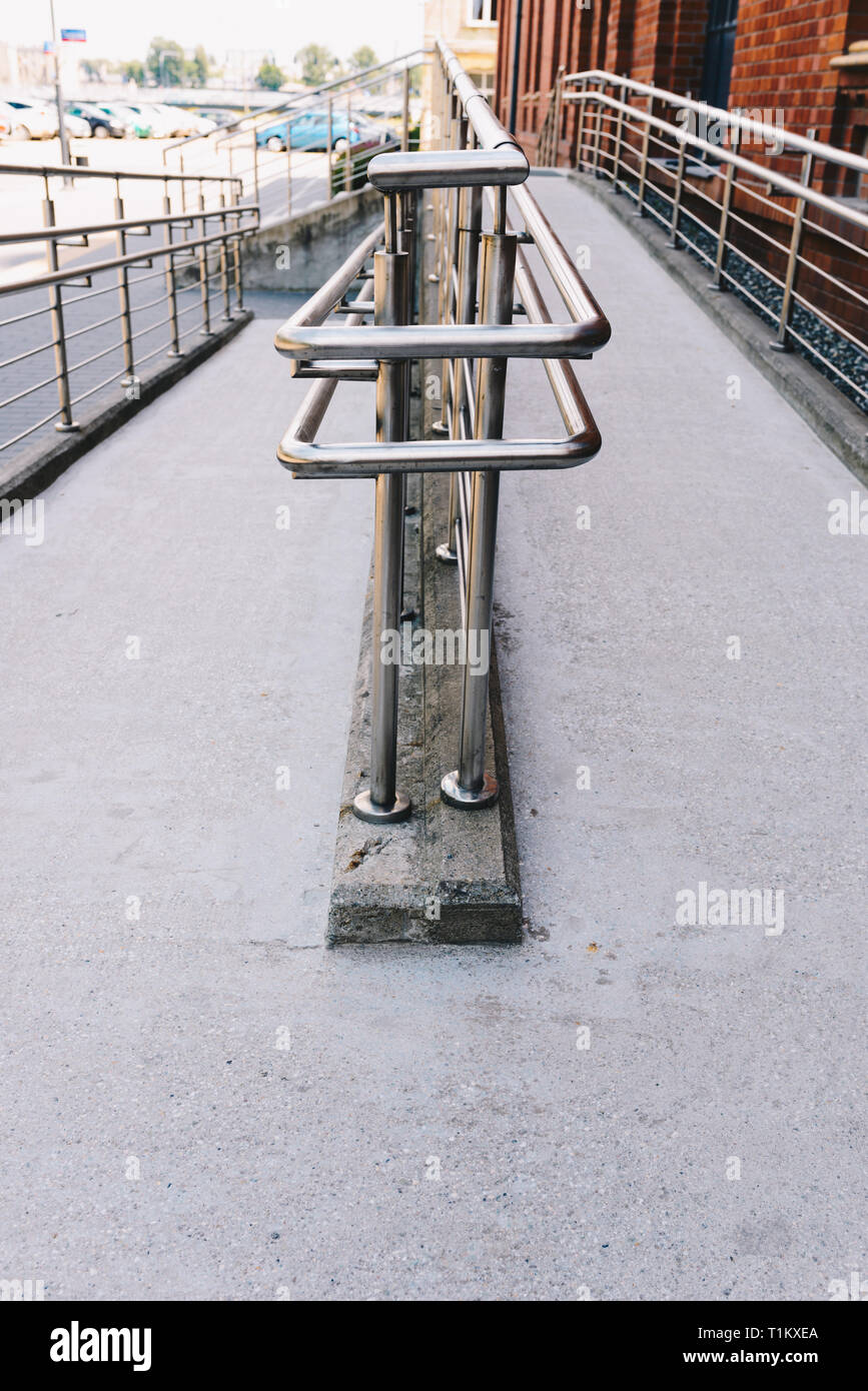 Concrete ramp way with stainless steel handrail for support wheelchair ...
