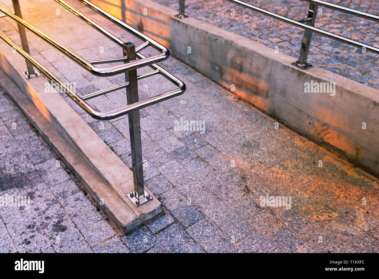 Concrete ramp - driveway - for wheelchairs with a stainless steel ...