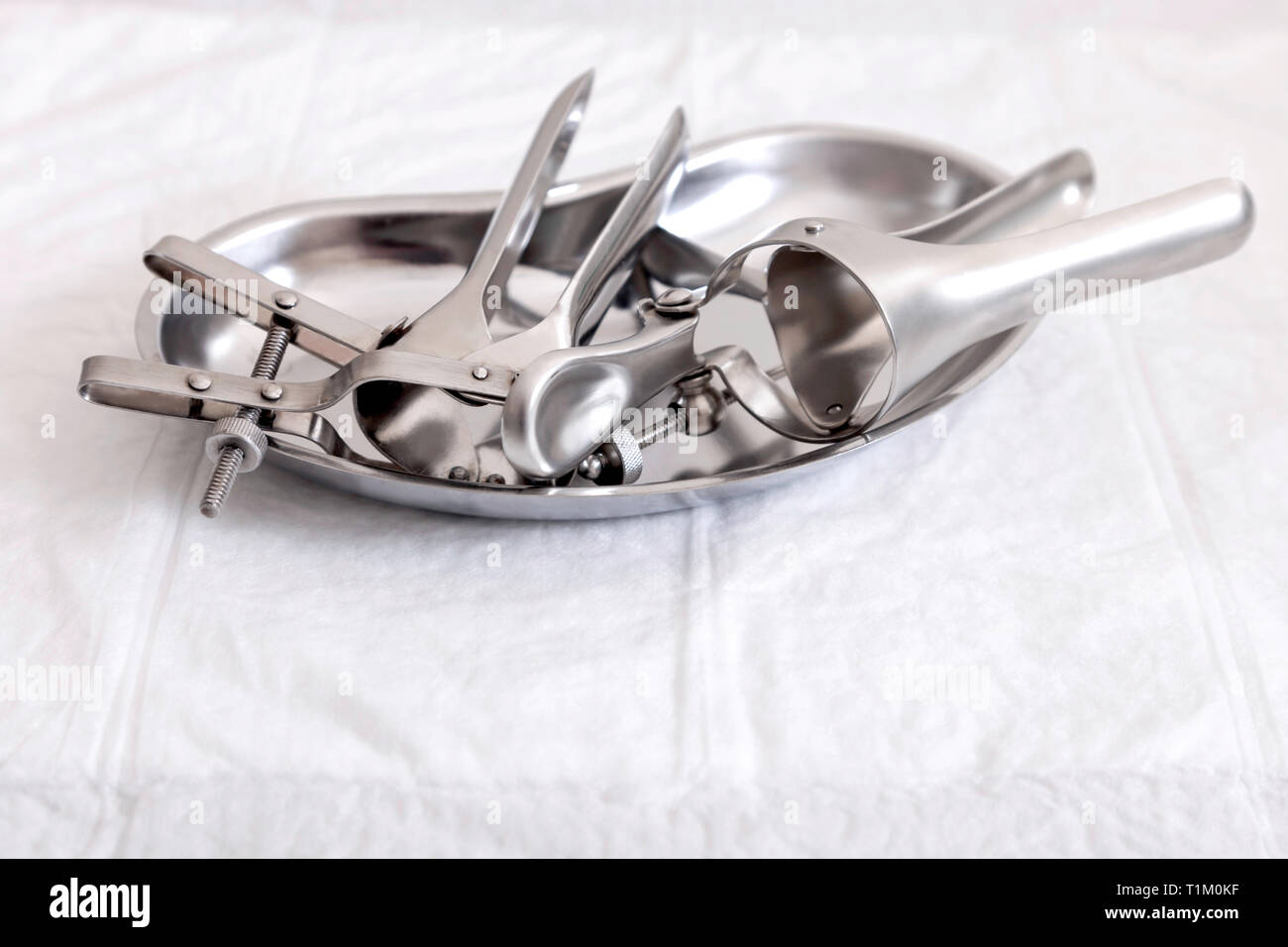 Gynecological sterile tools. A lot of instruments of gynecologist on ...