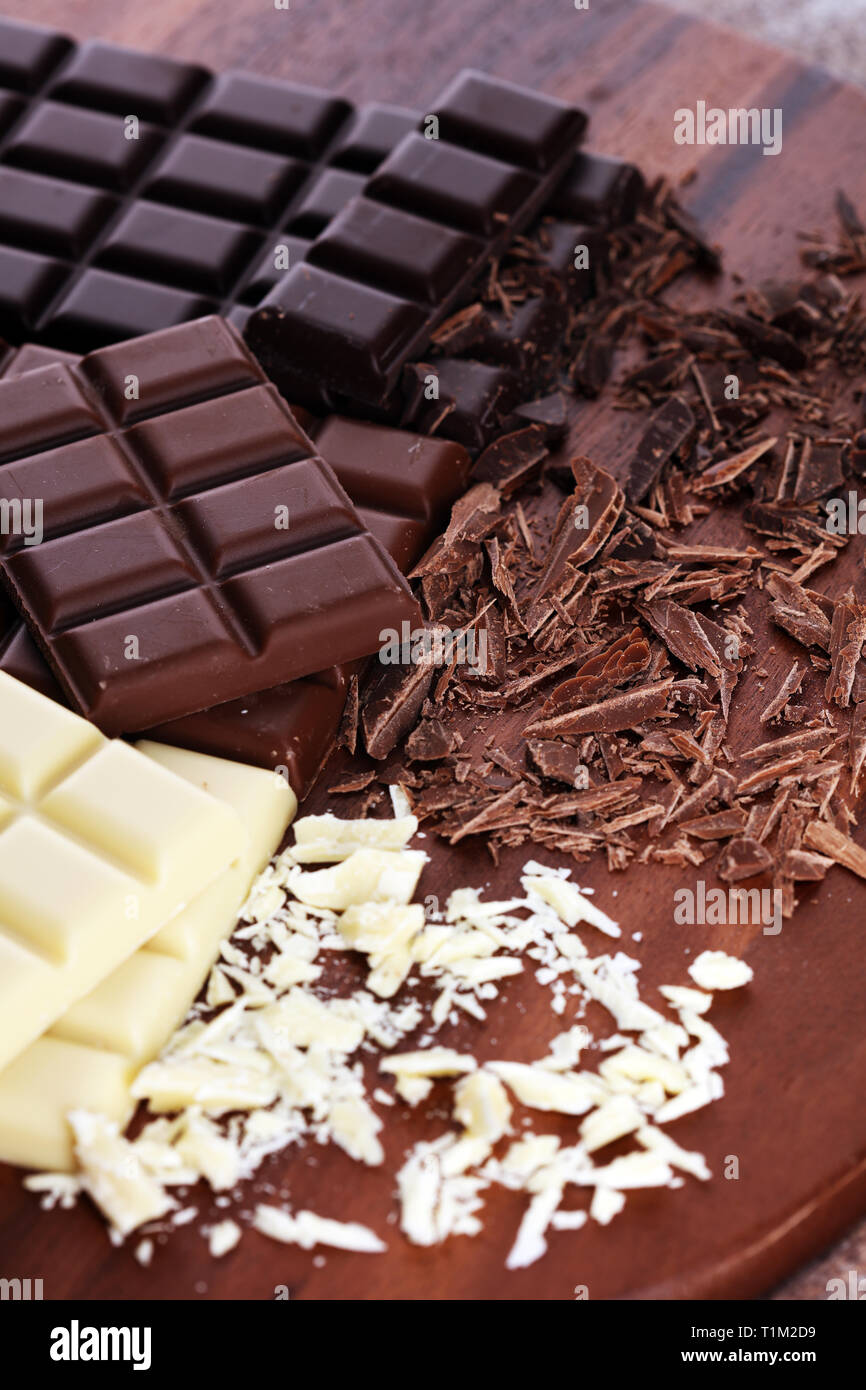 chocolate in diffrent color. milk, dark and white chocolate bars and ...