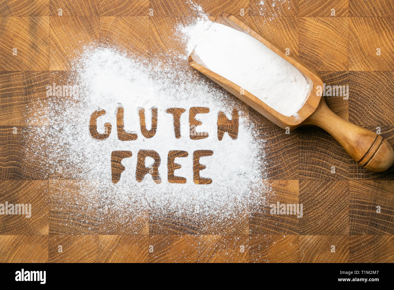 Gluten free concept - text on rice flour Stock Photo - Alamy
