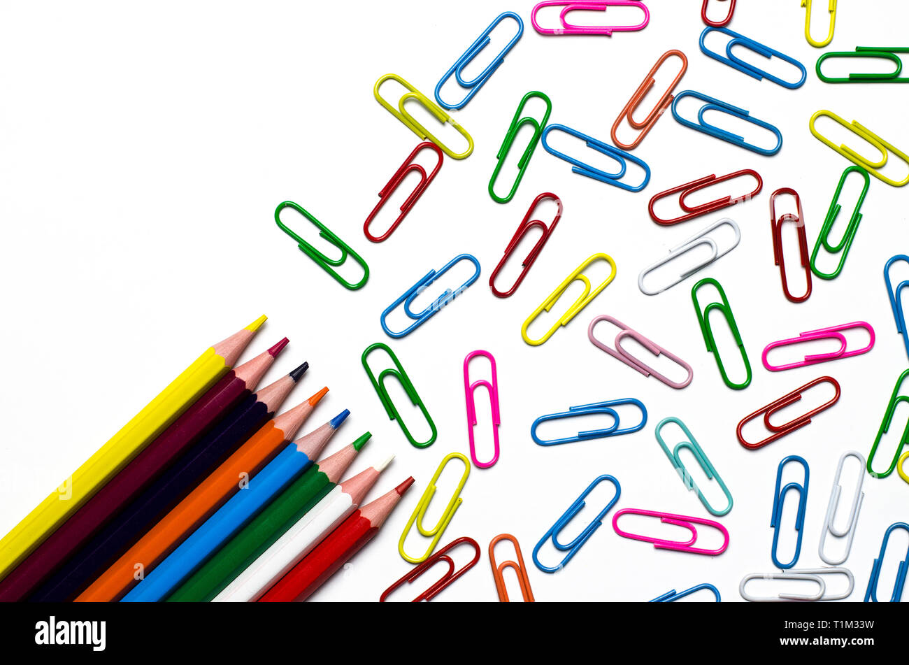 Many multi-colored stationery clips for documents and multi-colored ...