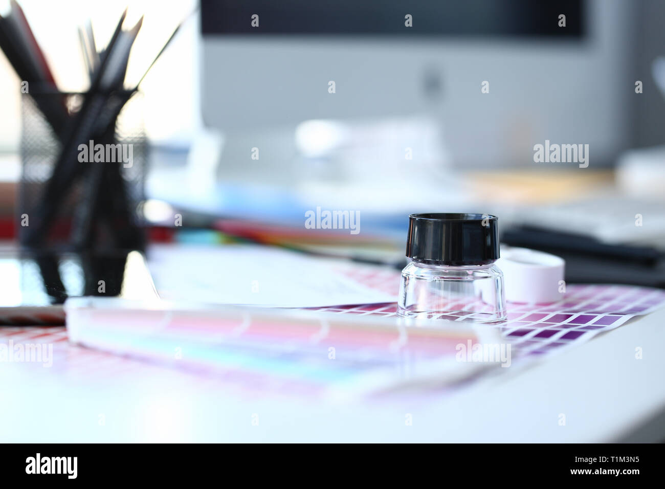 Test print paper page with colour test design fantail and magnifying ...