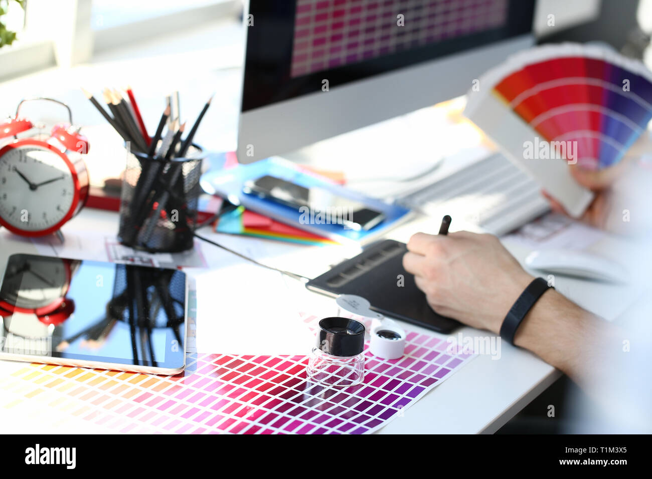 Test print paper page with colour test design fantail and magnifying ...