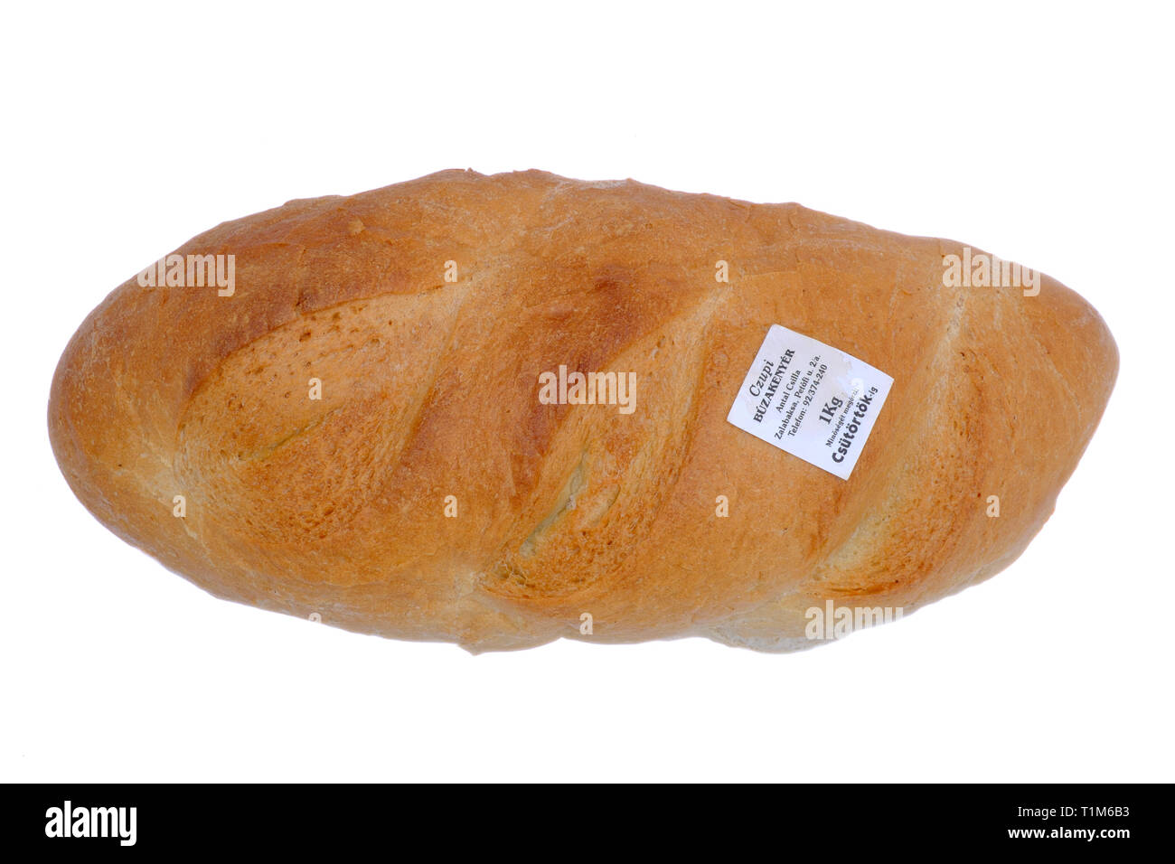 fresh unsliced white loaf with the bakers name label stuck directly ...