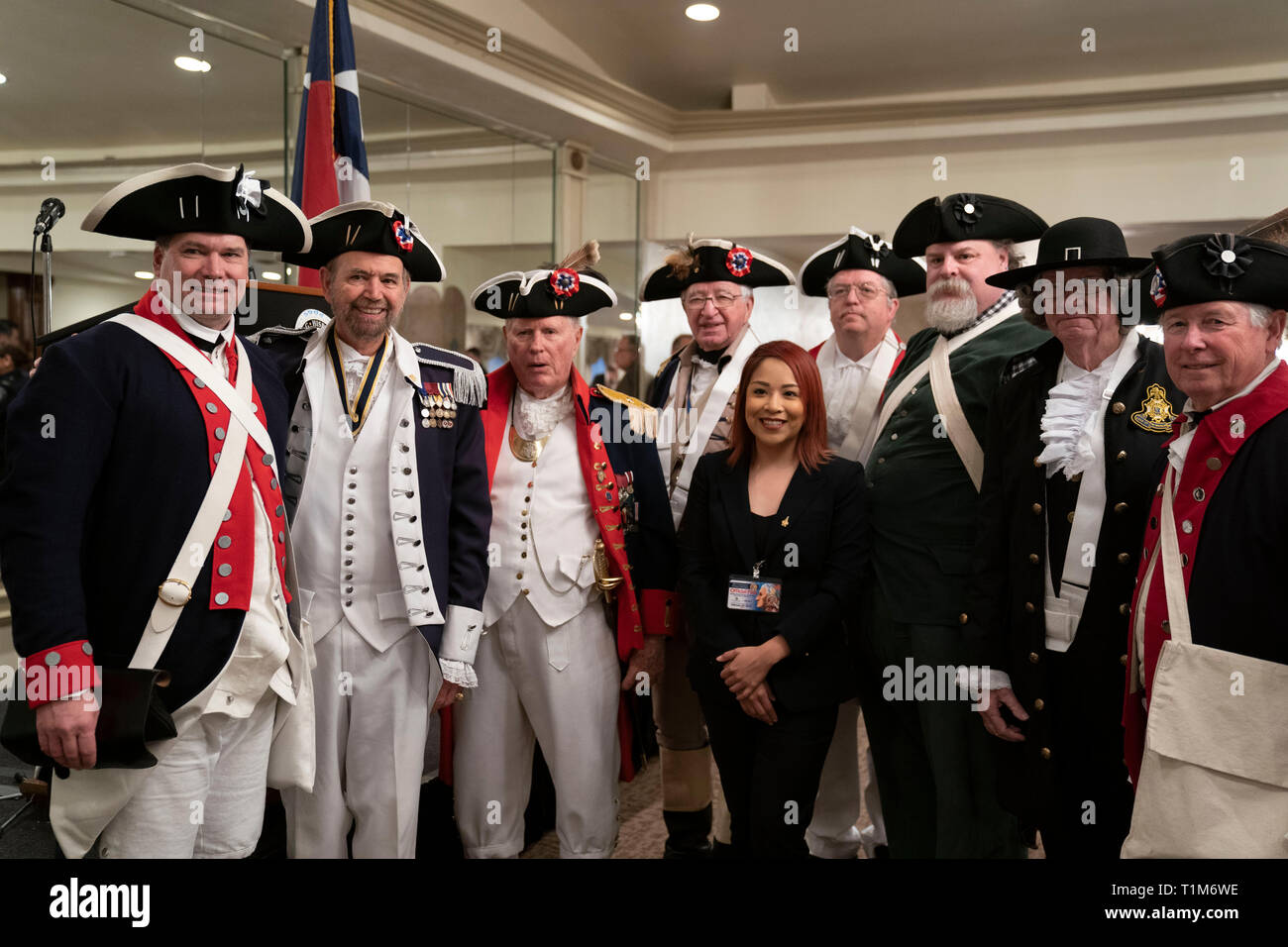 Men in American Revolutionary War-era style costumes pose before ...