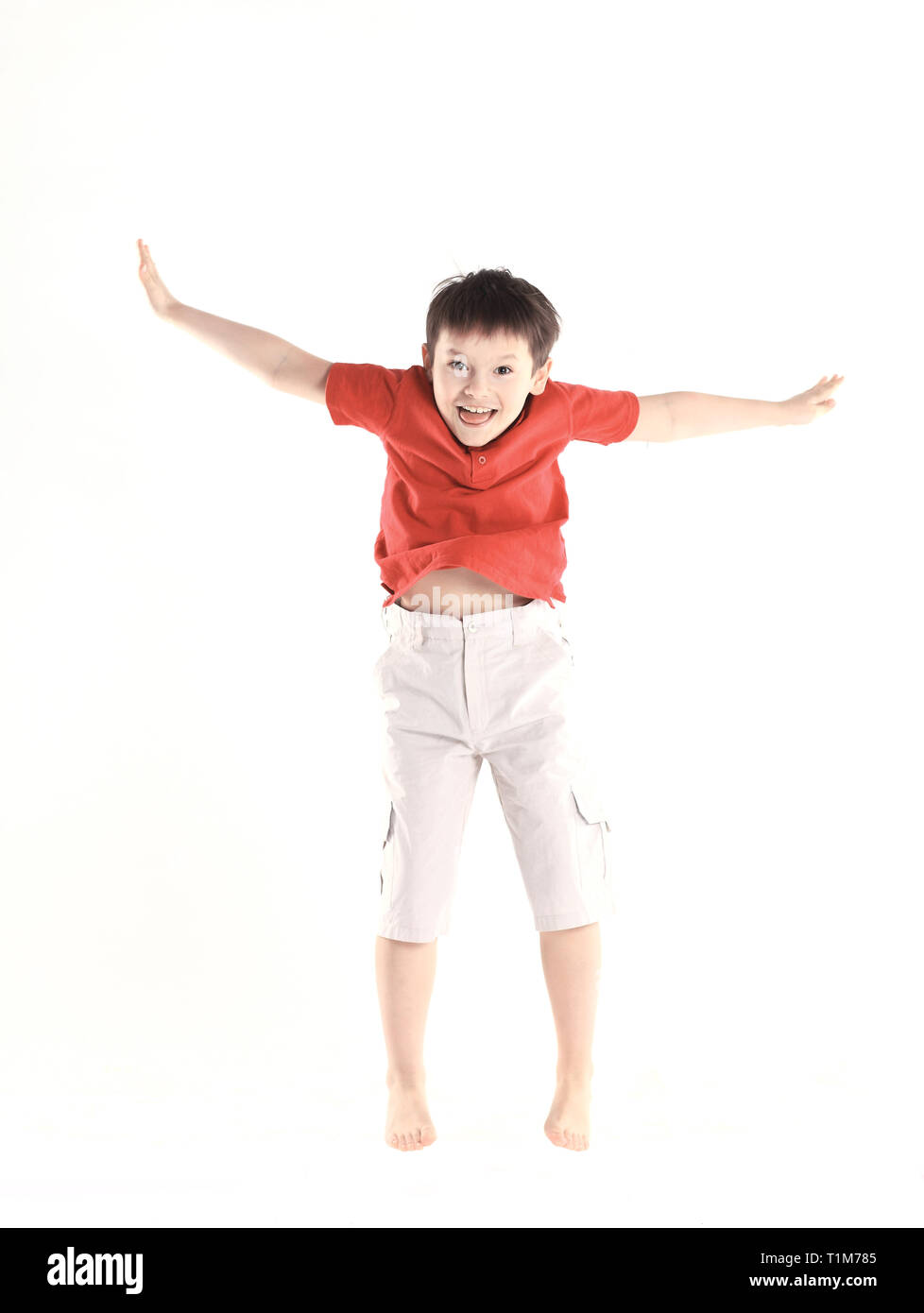 little boy performs a jumping exercise.isolated on white Stock Photo ...