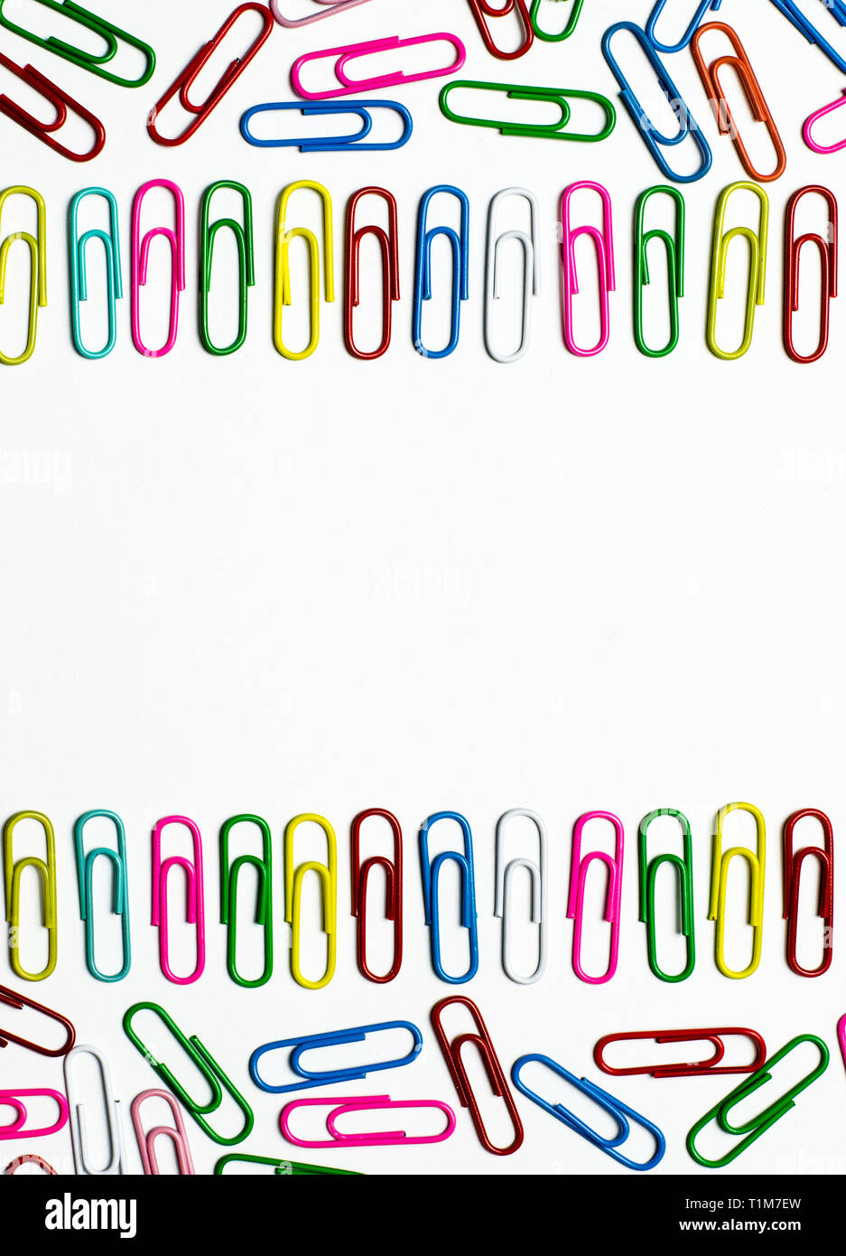 Many multi-colored stationery clips for documents and multi-colored ...