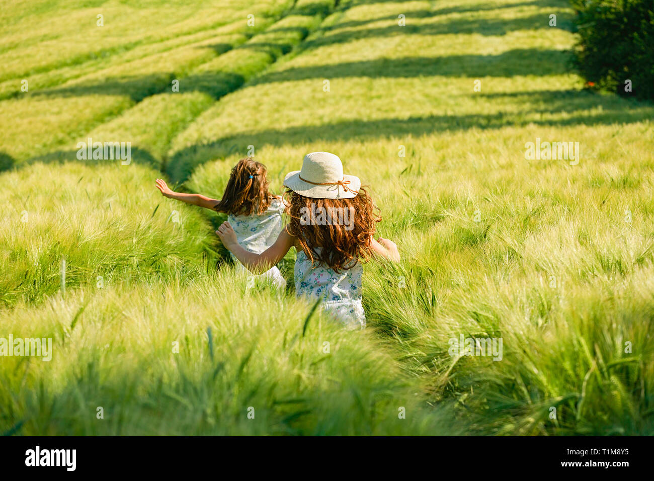 Two girls running away hi-res stock photography and images - Alamy
