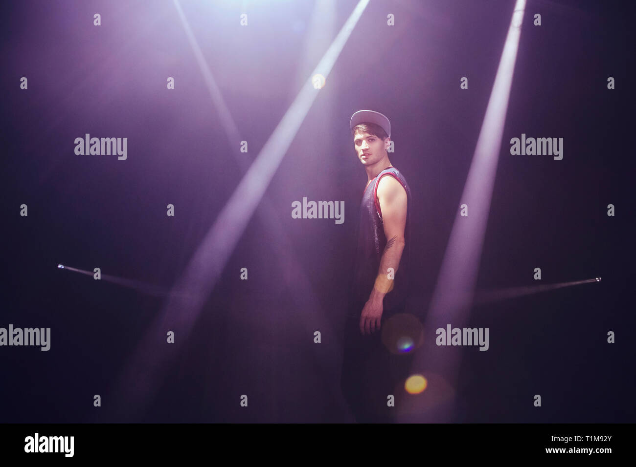 Portrait confident male modern dancer on stage Stock Photo - Alamy