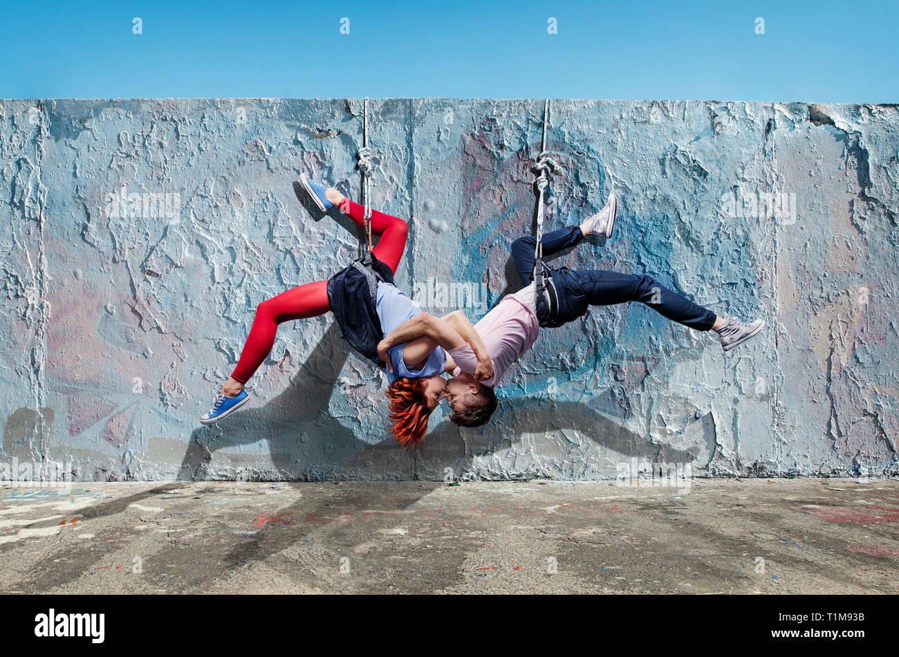 Young women hanging upside down hi-res stock photography and images - Alamy