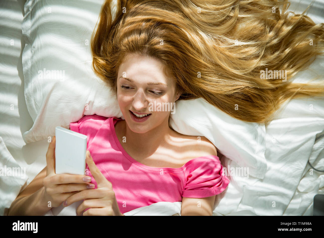 Morning sun light woman bedroom hi-res stock photography and images - Alamy