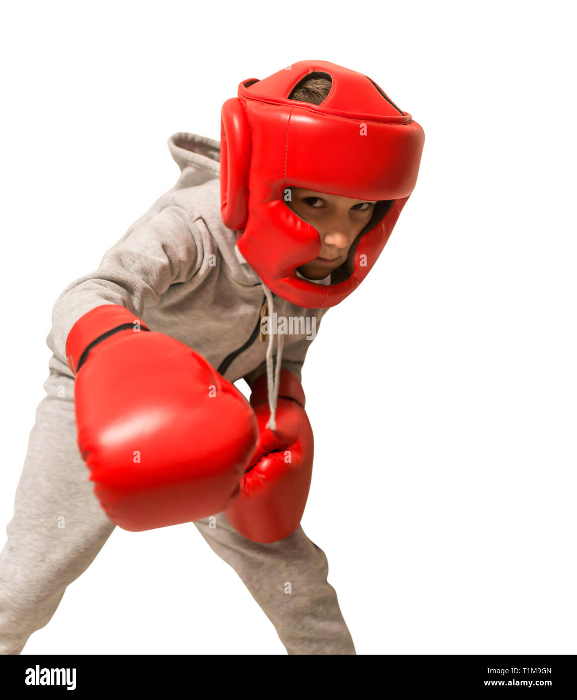 Young sportsman boxer with gloves and head protection. Ready to attack ...