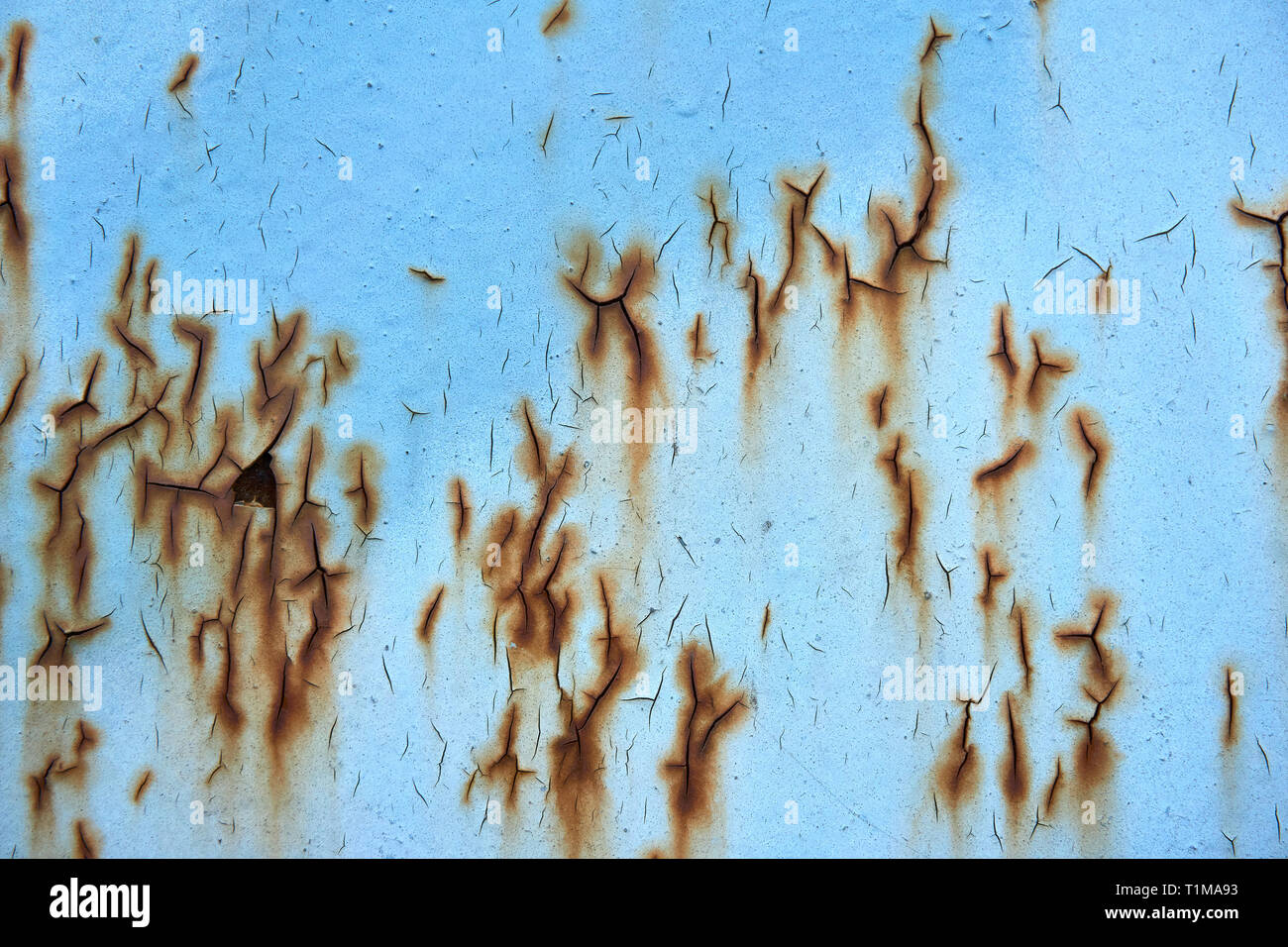 cracked color on a wall outside Stock Photo - Alamy