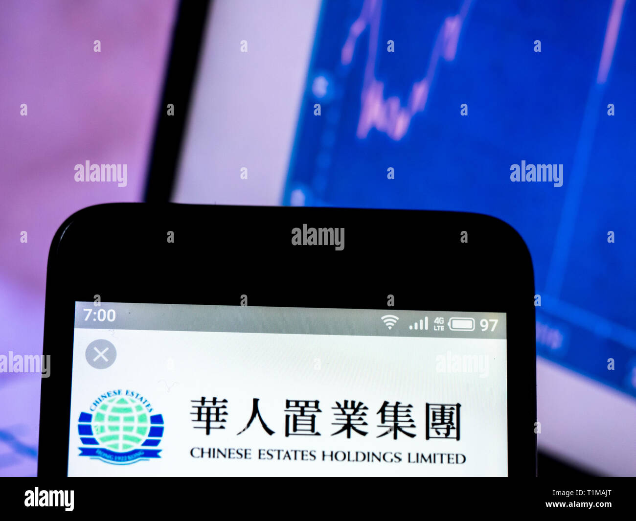 In this photo illustration a Chinese Estates Group logo seen displayed ...