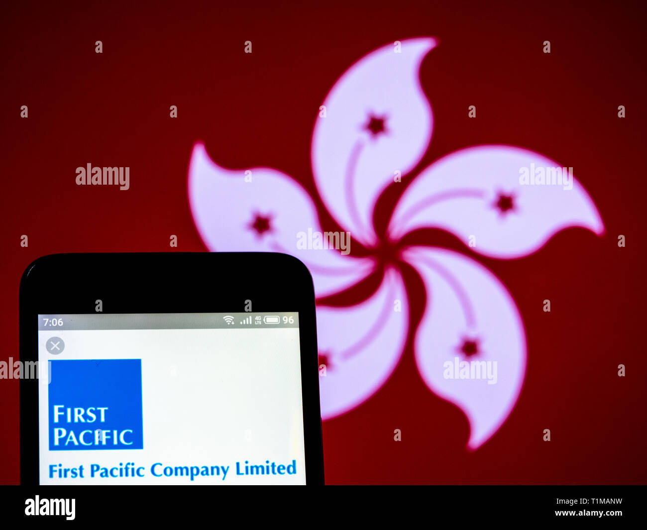 In this photo illustration a First Pacific Company logo seen displayed ...