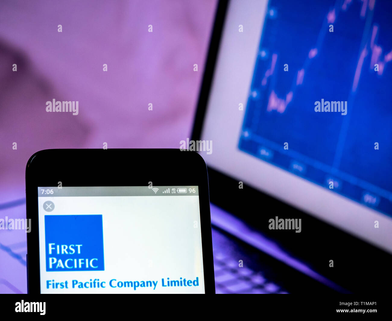 In this photo illustration a First Pacific Company logo seen displayed ...