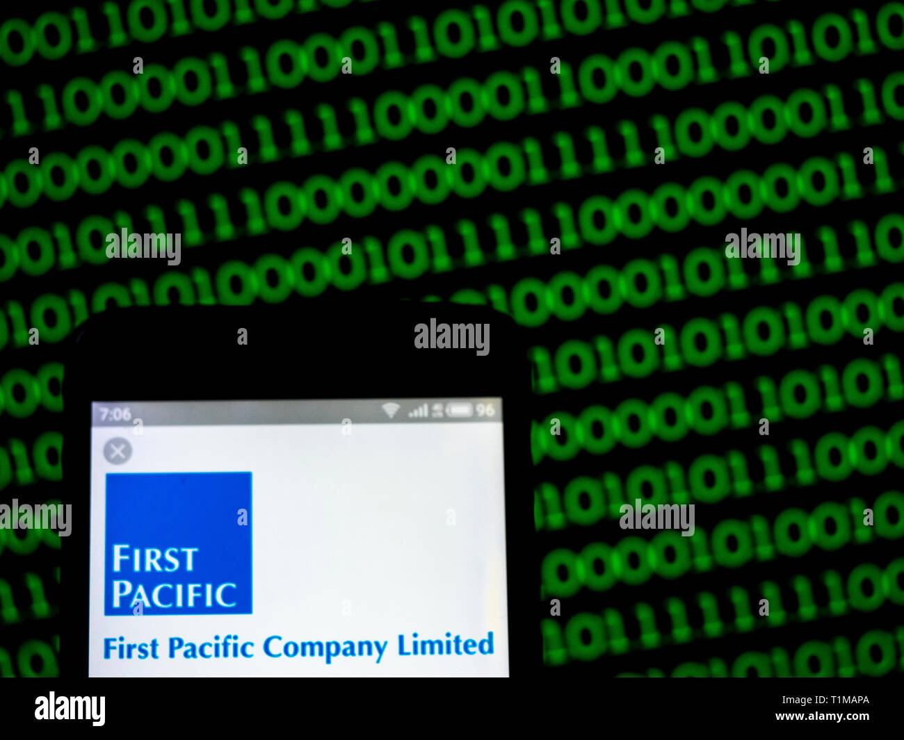 In this photo illustration a First Pacific Company logo seen displayed ...