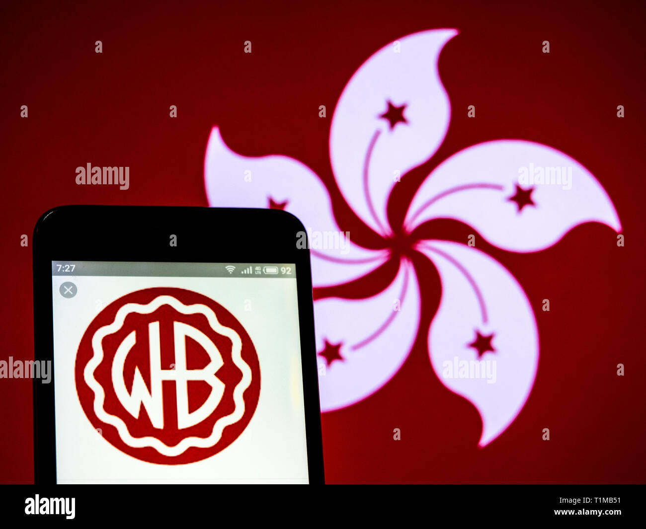 In this photo illustration a OCBC Wing Hang Bank logo seen displayed on ...
