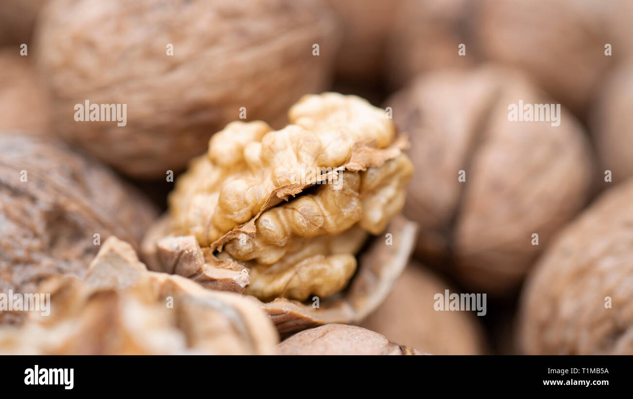 Walnut kernels and whole walnuts Stock Photo - Alamy