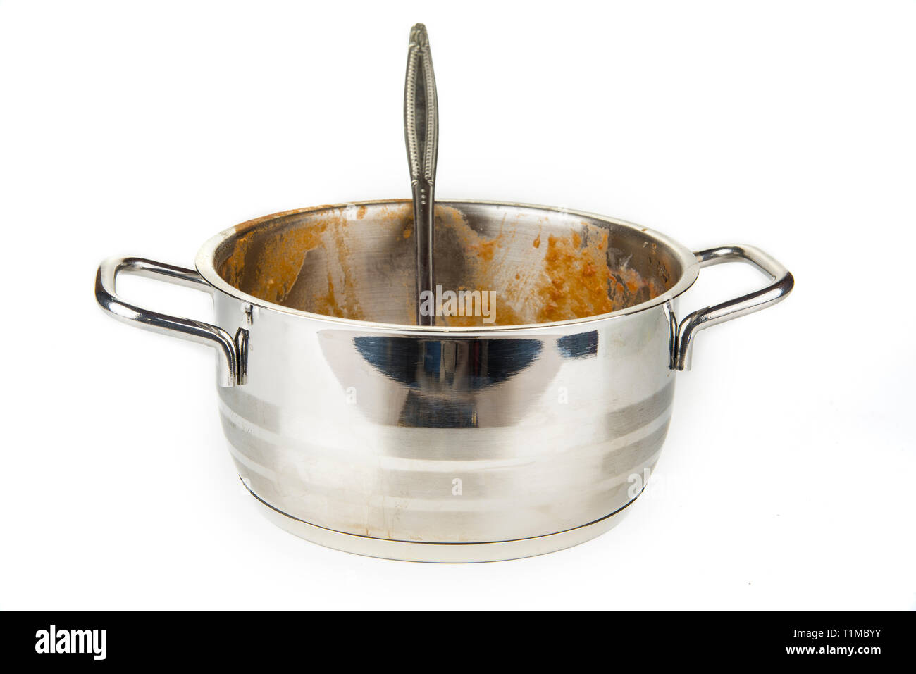 Dirty kitchen pot with ladle from a tomato soup Stock Photo - Alamy