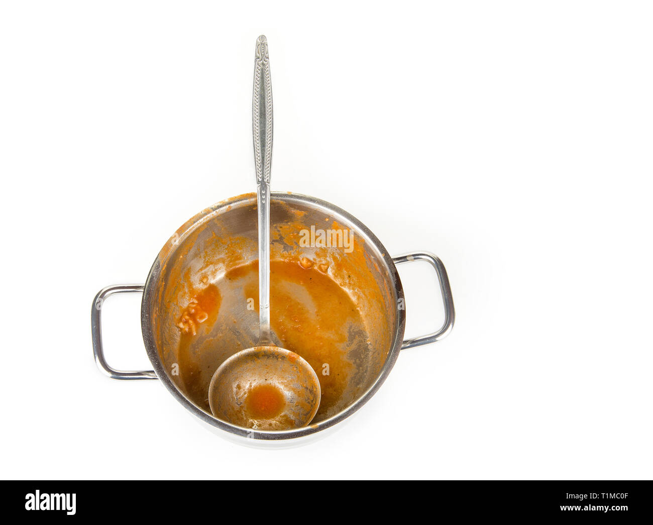 Dirty kitchen pot with ladle from a tomato soup Stock Photo - Alamy