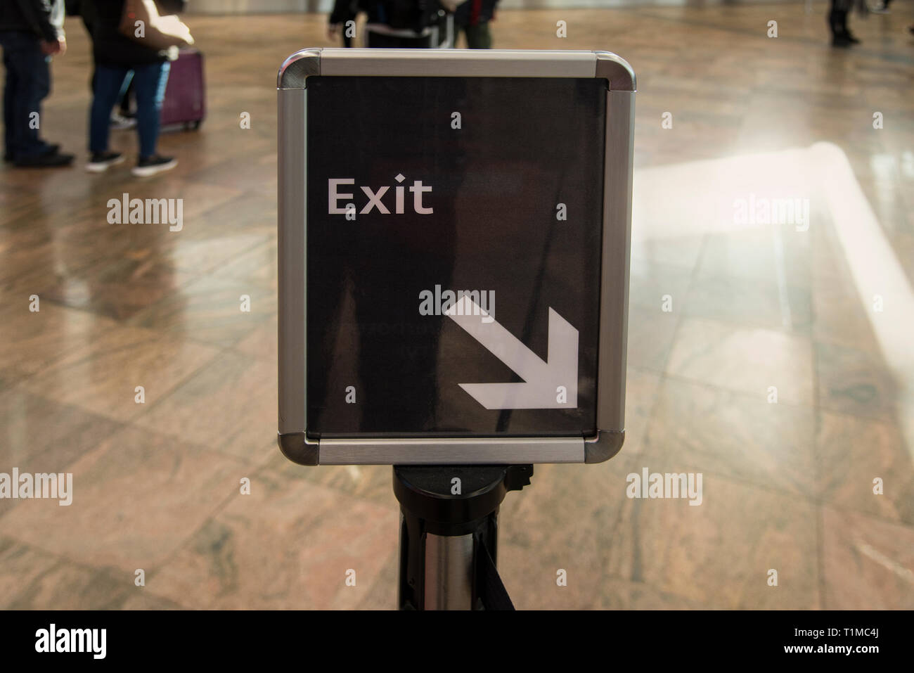 Bilingual exit sign at international airport or bank Stock Photo - Alamy