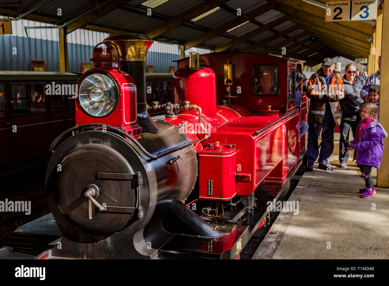 Front end of steam train that has just arrived at the railway station ...