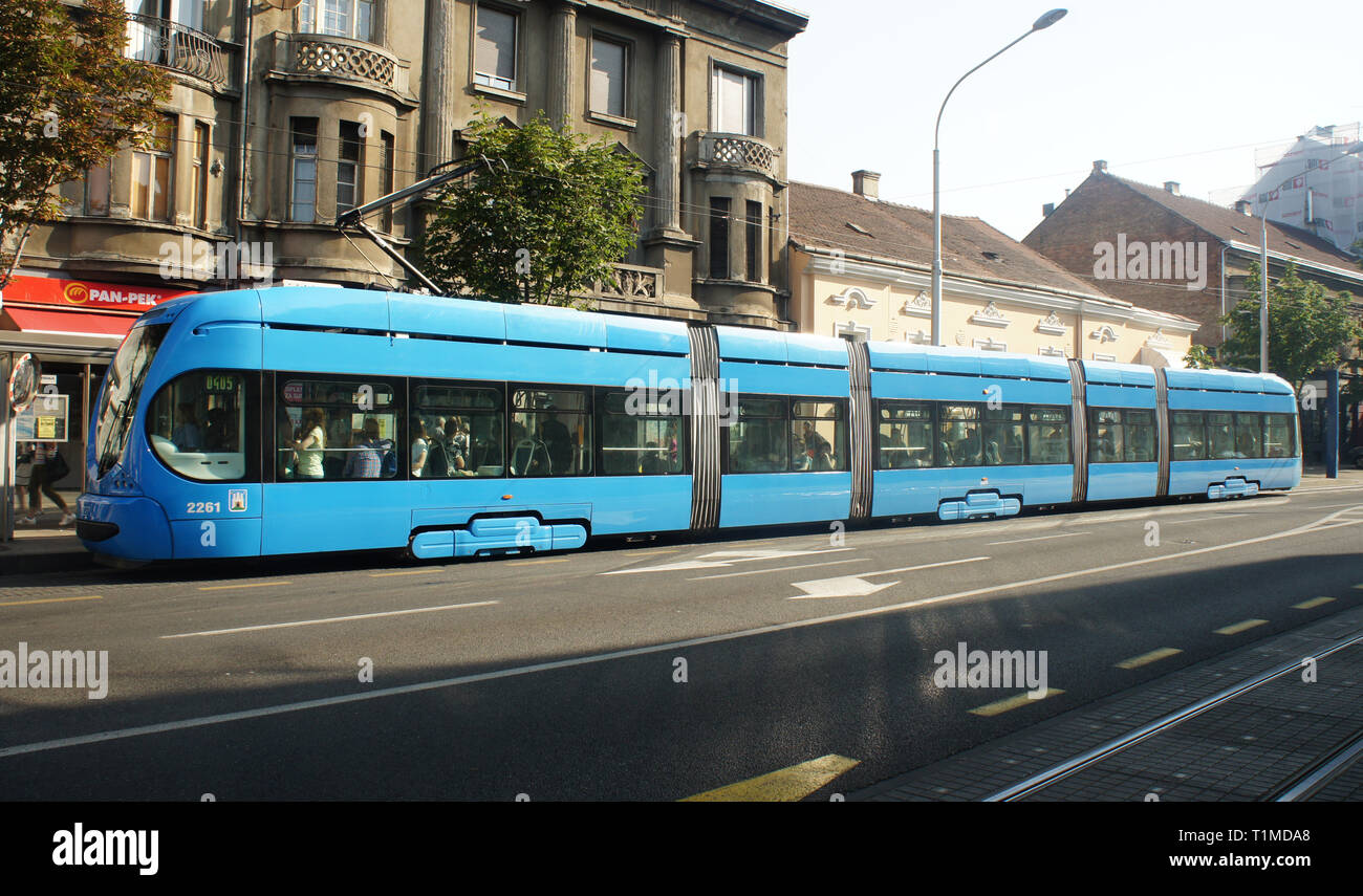Modern tram in the street, sunny day Stock Photo - Alamy