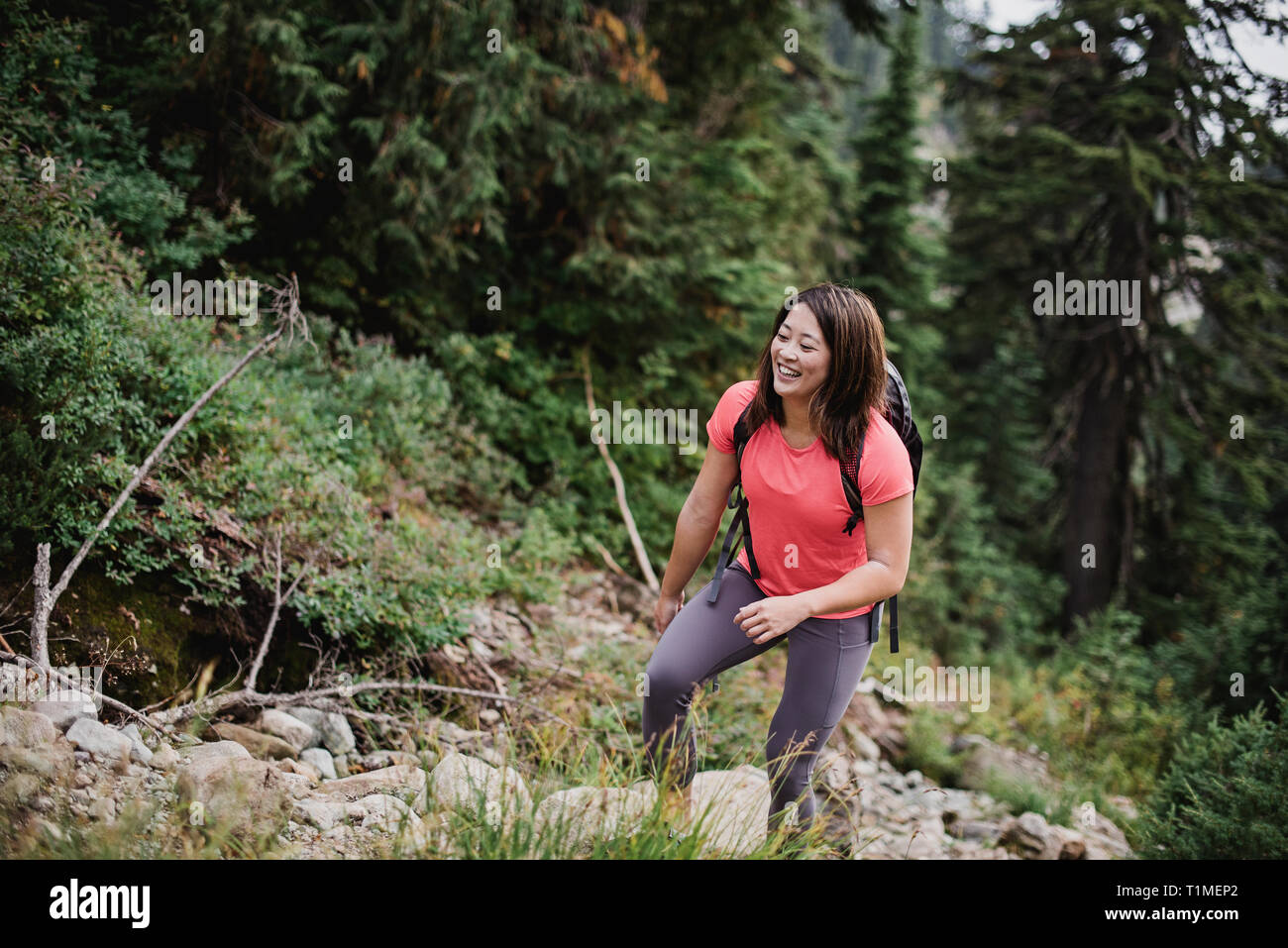 Woman walking woods smiling hi-res stock photography and images - Alamy