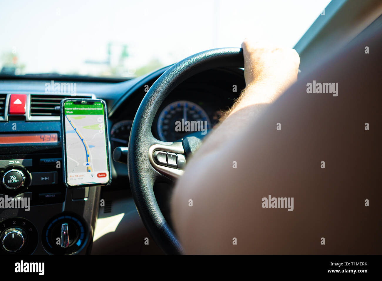 male driving a car on the road using a new, concept of traveling by car ...